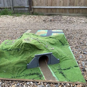 FreelyWheely: Model train tunnel with base