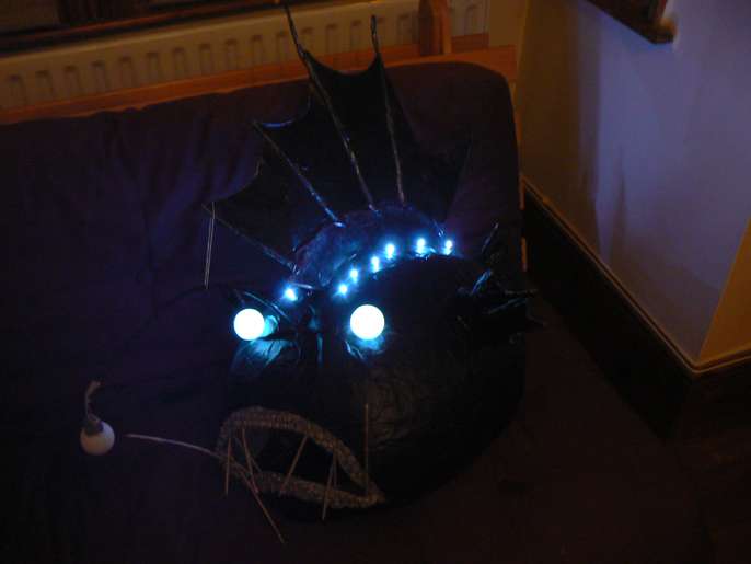 FreelyWheely: A pair of paper mache angler fish costumes