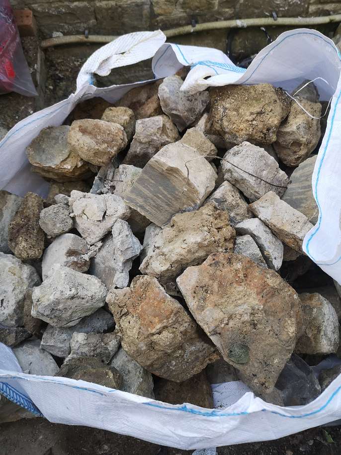 FreelyWheely: Mixed stone from old walls (Chert?)